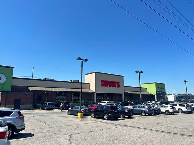 The bright red Savers sign beckons like a lighthouse to bargain hunters navigating the sea of retail options in Providence.