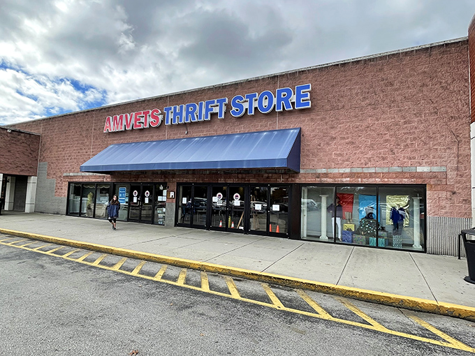 The AMVETS storefront stands like a treasure chest waiting to be unlocked, its blue awning a beacon for bargain hunters across Knoxville.