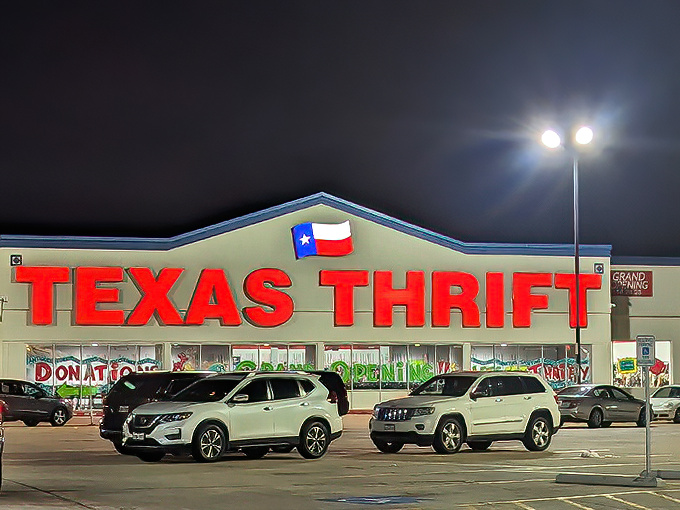 The iconic Texas Thrift sign glows like a beacon for bargain hunters at night, promising treasures within its cavernous depths.