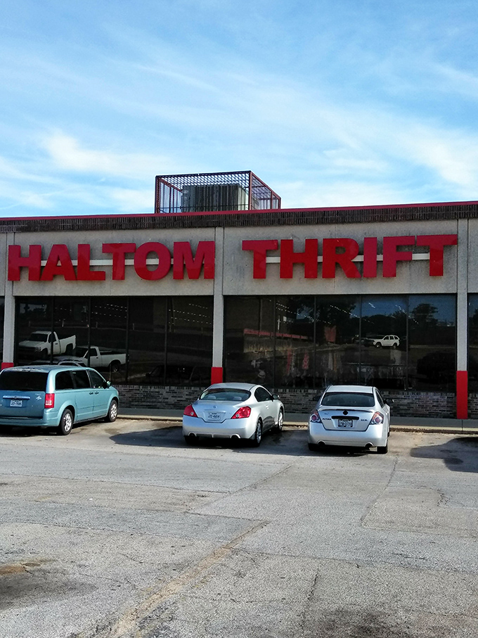 The bold red letters of Haltom Thrift stand like a beacon of bargain hope against the Texas sky. Treasure hunting starts here!