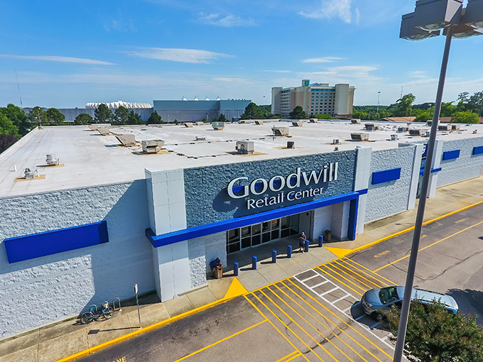 The blue-trimmed facade of Hampton's Goodwill stands like a retail promised land against the Virginia sky, beckoning bargain hunters from miles around.