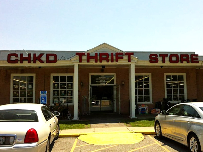 The iconic red lettering of CHKD Thrift Store beckons treasure hunters like a lighthouse for bargain seekers. Every visit supports children's healthcare while satisfying your thrifting addiction.