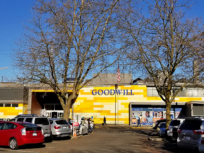 The sunshine-yellow exterior of Seattle Goodwill stands like a beacon of bargain hope against Washington's famously moody skies.