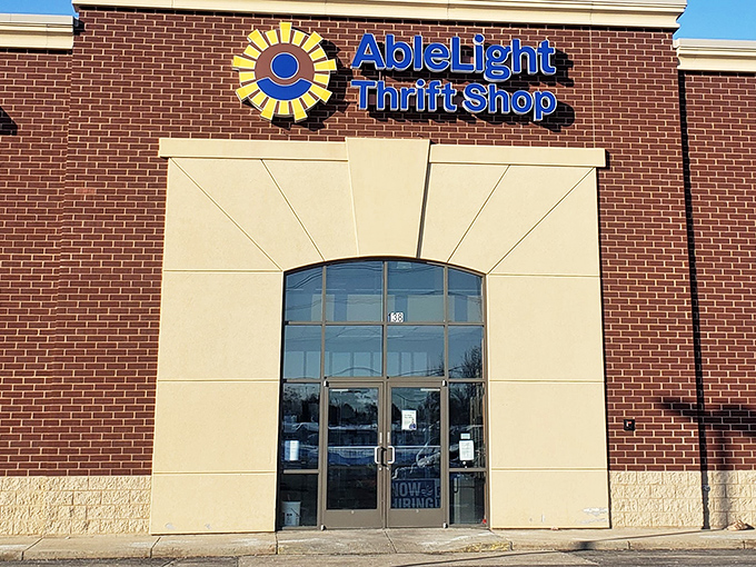 The sunshine-bright logo of AbleLight Thrift Shop beckons bargain hunters like a retail lighthouse on Appleton's shopping landscape.