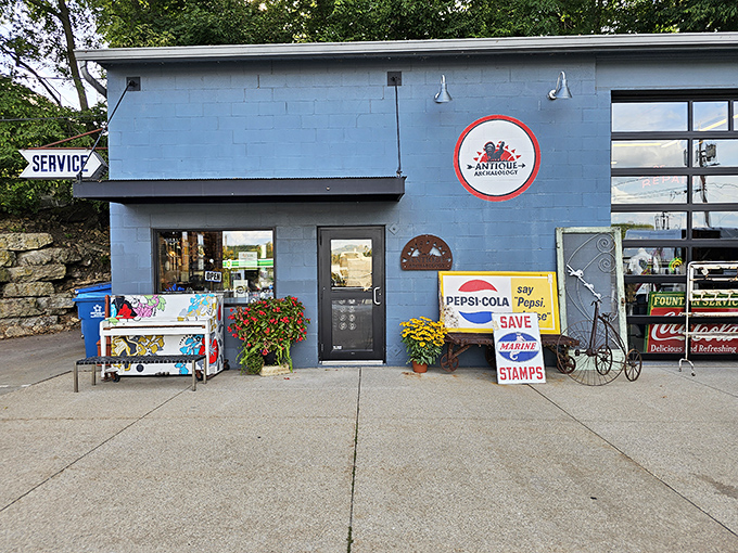 The blue facade of Antique Archaeology beckons like a portal to America's past, complete with vintage Pepsi signs that'll make your grandpa misty-eyed.