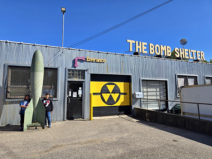 The exterior screams "Cold War chic" with its corrugated metal facade, nuclear symbol, and yes&mdash;that's an actual missile prop greeting visitors.