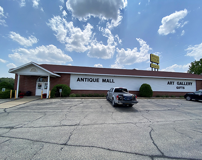 The stately white building with its distinctive red roof stands like a temple to nostalgia, beckoning treasure hunters from Interstate 90/94 with promises of discoveries within.
