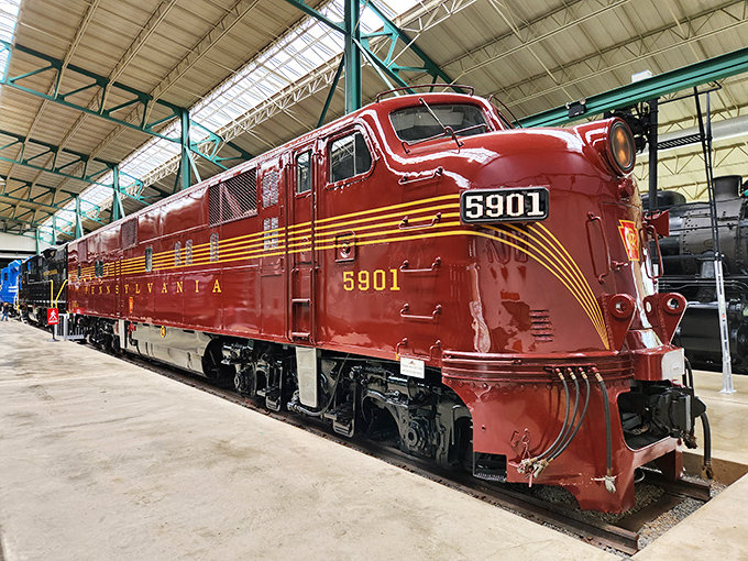 The Pennsylvania Railroad's iconic 5901 diesel locomotive gleams in cherry red, like a sports car that decided to hit the gym.