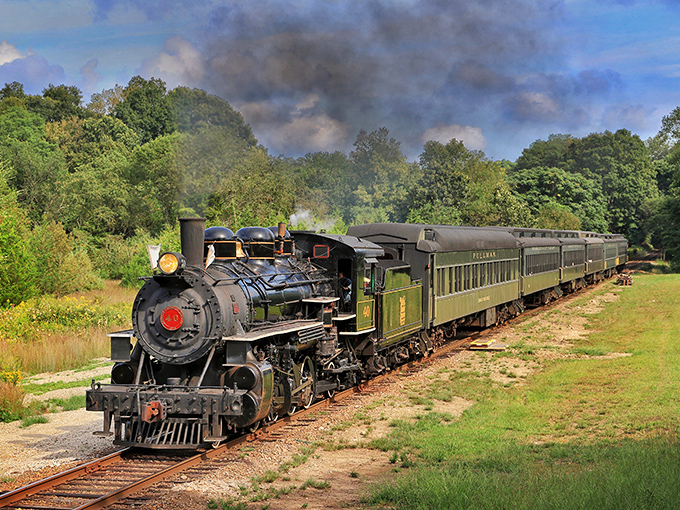 Steam and autumn leaves create a Connecticut postcard moment that makes modern transportation look boring by comparison.