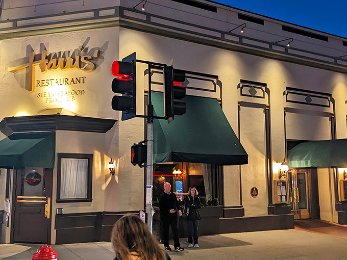 Harris' iconic exterior glows like a beacon for meat lovers, those green awnings practically whispering, "Come in, we've got what you're craving."