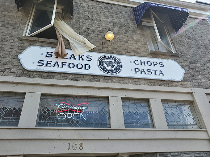 A closer look at the promise displayed above: Steaks, Seafood, Chops, and Pasta. Like a delicious haiku written in neon and nostalgia.