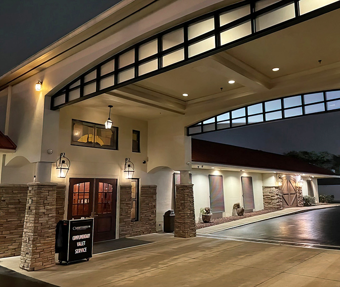 The elegant entrance to Christner's beckons like a beacon in the night, promising refuge from Orlando's tourist chaos and entry to a world of culinary sophistication.