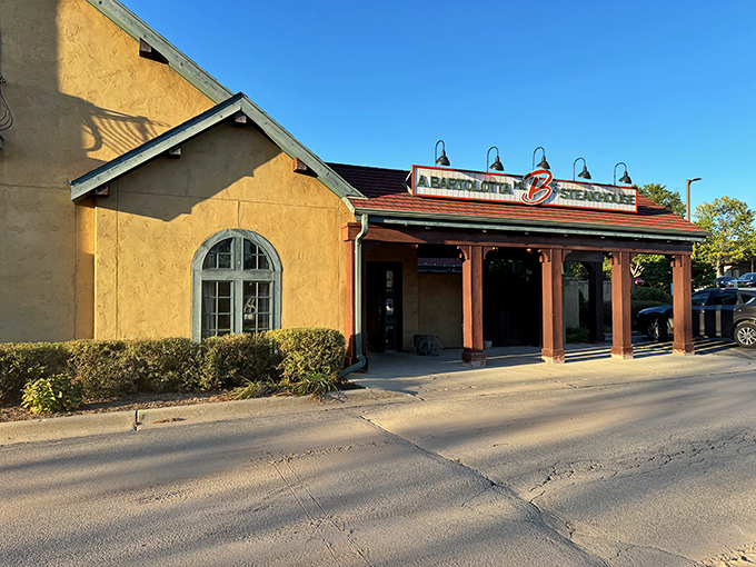 The warm terracotta exterior of Mr. B's welcomes you like an old friend who happens to make the best steak in town. That iconic red "B" practically winks at hungry passersby