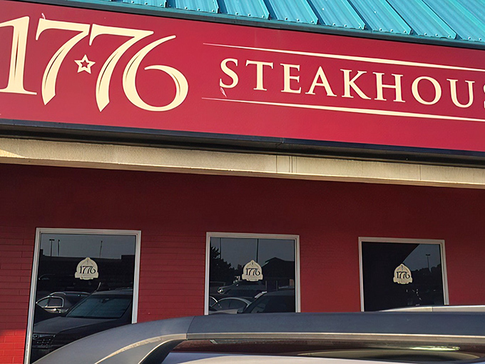 The iconic red exterior of 1776 Steakhouse stands as a beacon for carnivores, promising revolutionary flavors behind those patriotic doors.