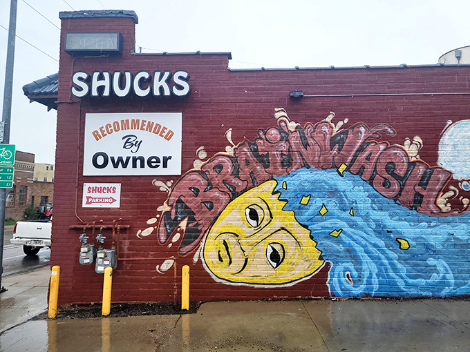 That cheeky pufferfish mural practically winks at passersby, promising something deliciously different inside this brick building. Omaha's seafood rebellion in full color.