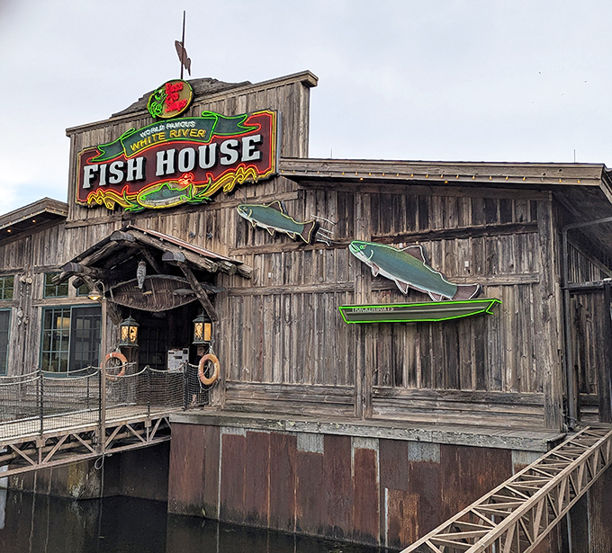 The weathered wooden exterior isn't just rustic charm&mdash;it's a promise of authenticity. This floating fish sanctuary beckons hungry travelers with its unmistakable Ozark character.