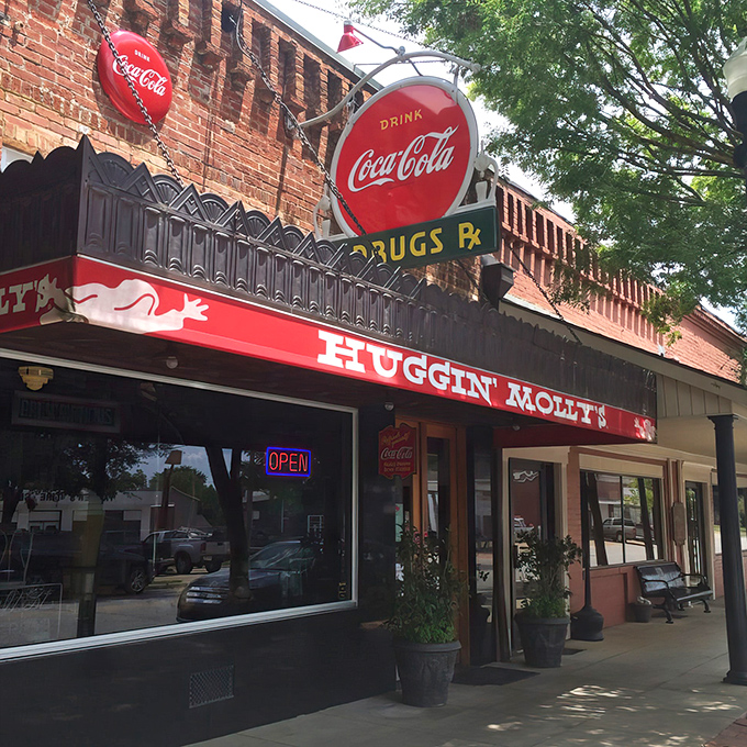 The iconic red awning and vintage Coca-Cola signs of Huggin' Molly's beckon like a time portal to simpler days in downtown Abbeville.