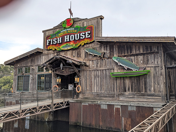 The weathered wooden exterior of White River Fish House looks like it was plucked straight from a Mark Twain novel and plopped onto the water's edge.