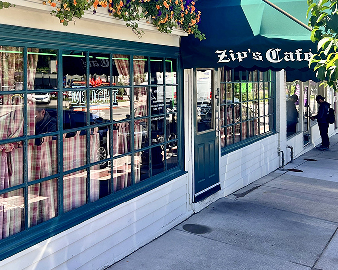 The unassuming storefront of Zip's Cafe, with its classic green awning and neon sign, promises burger bliss without the fanfare. Cincinnati's best-kept secret hides in plain sight.