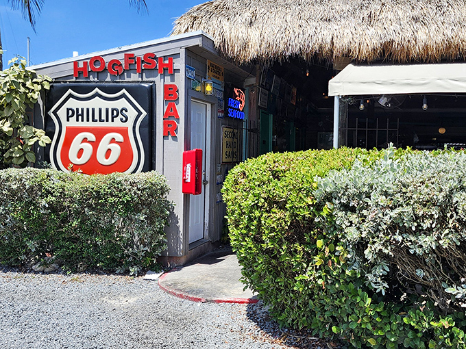 The entrance to paradise isn't pearly gates, but a weathered Phillips 66 sign and bright red HOGFISH letters beckoning seafood lovers to Stock Island's hidden gem.