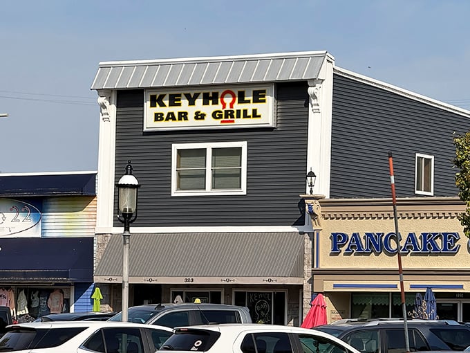 The unassuming gray exterior of Keyhole Bar & Grill stands like a culinary sentinel in Mackinaw City, promising treasures that tourist traps can only dream about.