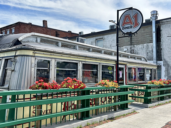 The gleaming silver exterior of A1 Diner stands like a time capsule against Gardiner's brick backdrop, a Worcester Lunch Car waiting to transport you to comfort food nirvana.