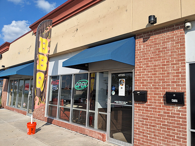 That neon "OPEN" sign might as well say "HEAVEN." J's modest exterior belies the smoky magic happening inside this Omaha strip mall gem.