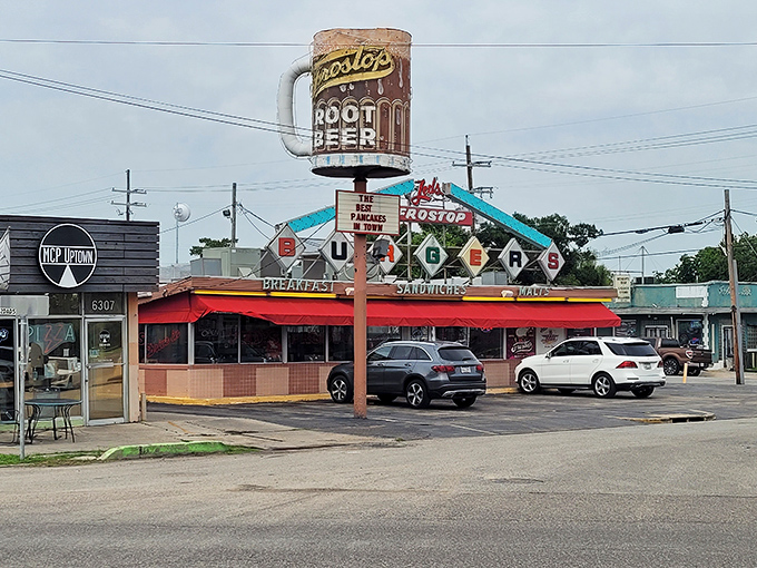 That iconic root beer mug sign isn't just a landmark—it's a beacon of hope for hungry travelers seeking burger nirvana in New Orleans.