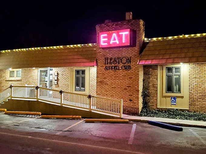 That glowing "EAT" sign at night is basically a beacon calling all hungry souls home to happiness.