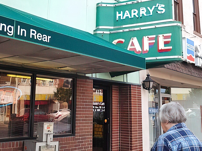 "Parking In Rear" might be the most important directional sign in Kansas – it leads you to cheeseburger nirvana at Harry's, where diet plans go to die happily.