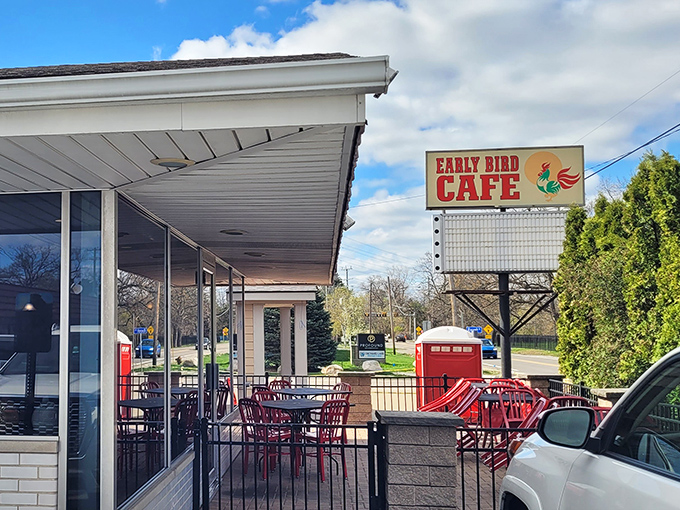 Red patio furniture and that iconic rooster sign welcome early risers like an old friend who always has coffee ready.