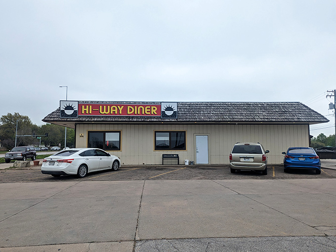 The iconic yellow sign against Nebraska's big sky promises comfort food salvation at any hour. This unassuming roadside haven has been feeding Lincoln for generations.