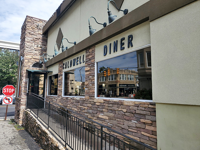 The stone facade of Caldwell Diner stands like a humble culinary fortress, promising comfort food treasures within its unassuming exterior.