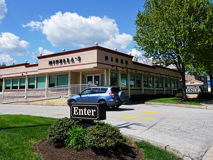 The classic diner silhouette of Minella's stands proudly on Lancaster Avenue, beckoning hungry travelers with its timeless charm and that unmistakable "Enter" sign.