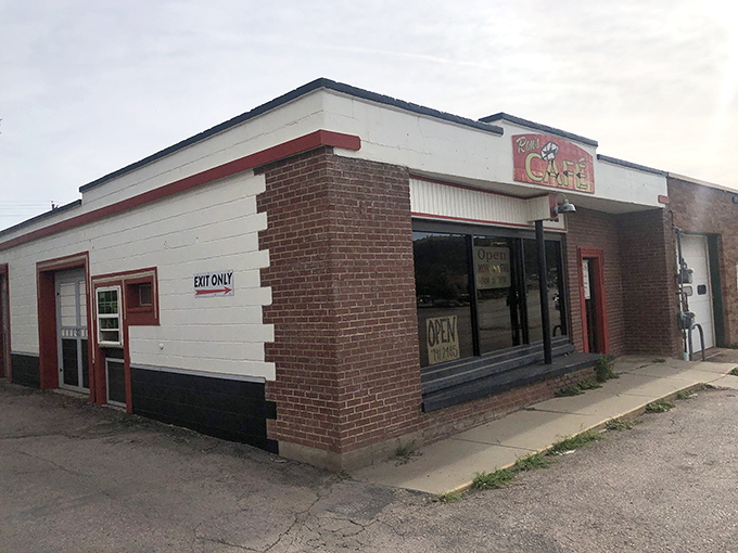 The unassuming exterior of Ron's Caf&eacute; proves once again that culinary treasures often hide in plain sight. Those red-trimmed doors are portals to breakfast nirvana.