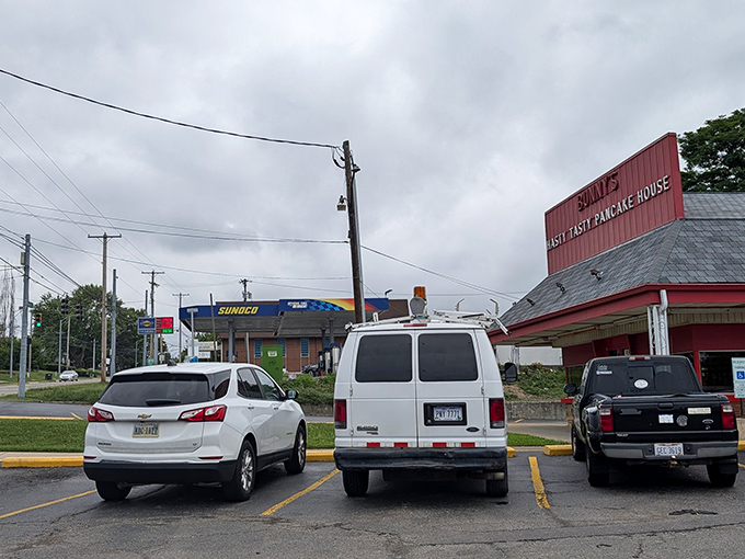 Even on cloudy days, this roadside classic draws a steady stream of vehicles – proof that good food trumps fancy architecture every time.