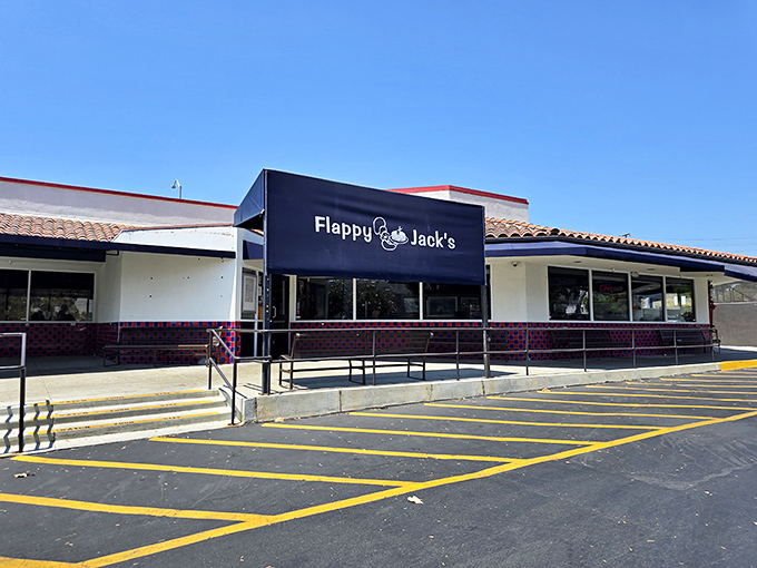 The unassuming exterior of Flappy Jack's belies the breakfast magic happening inside. Blue awning, red trim, and a promise of pancake perfection.