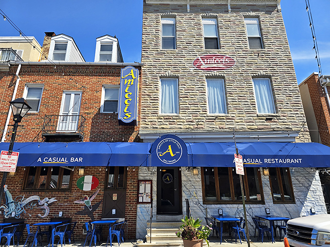 Amicci's iconic blue awning and vertical sign stand out in Baltimore's Little Italy like a beacon for hungry souls seeking Italian comfort food paradise.