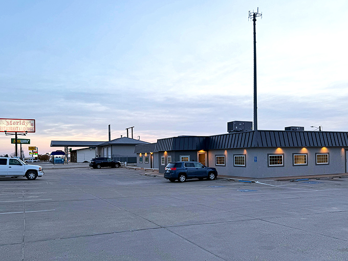 The unassuming exterior of Meridy's stands like a beacon for hungry travelers, promising comfort food salvation just off the highway in Russell, Kansas.