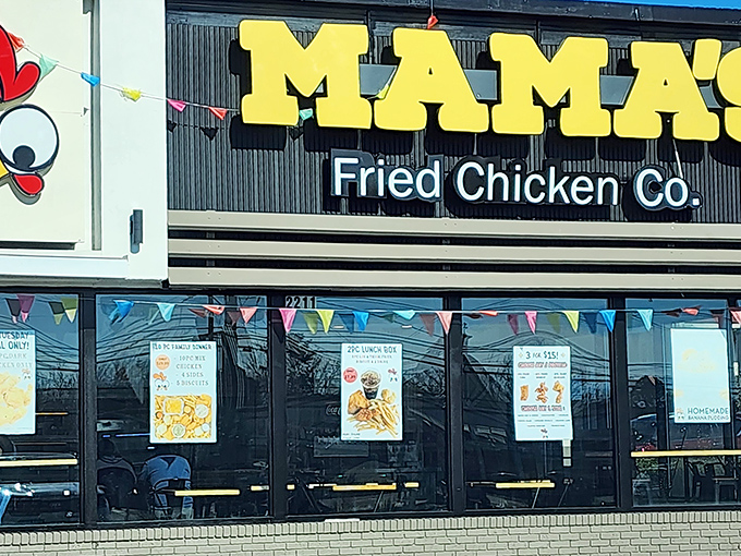 The cheerful chicken logo winks at passersby, a beacon of comfort food promise. Mama's bold yellow signage practically dares you to drive past without stopping.