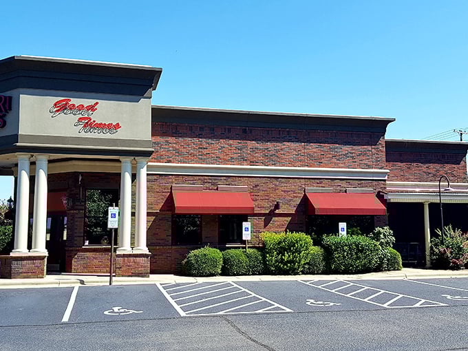 Red awnings and meticulous landscaping welcome you to this brick-clad oasis. First impressions matter, and Safari Miles clearly got the memo.