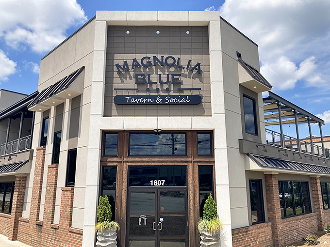 The modern facade of Magnolia Blue welcomes you with warm wooden doors and lush greenery &ndash; like finding a secret clubhouse where the password is "delicious."