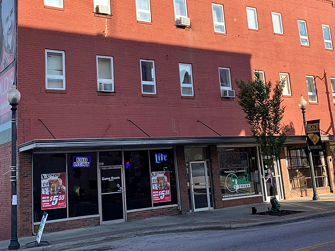 The unassuming exterior might not scream "culinary destination," but locals know those neon beer signs are actually beacons guiding you to cheeseburger paradise.