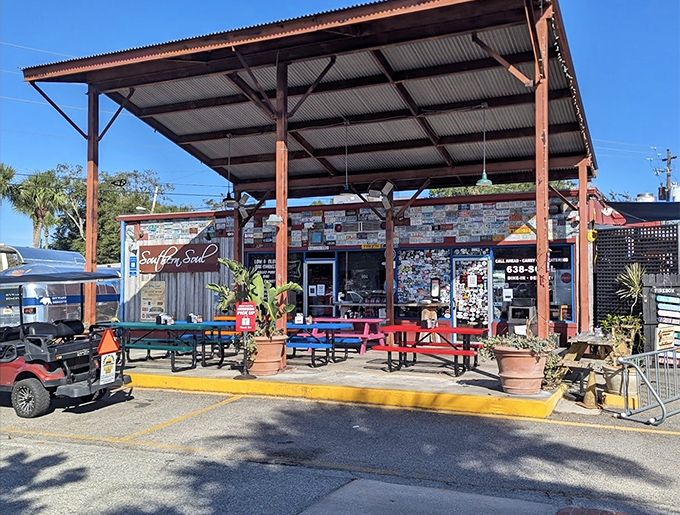The converted gas station exterior speaks volumes: great barbecue doesn't need fancy digs, just picnic tables, sunshine, and smoke signals that say "get here now."