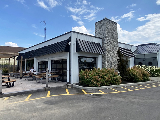 The white exterior with its stone chimney and black awnings stands like a beacon for seafood lovers. No fancy frills needed when the food does the talking.
