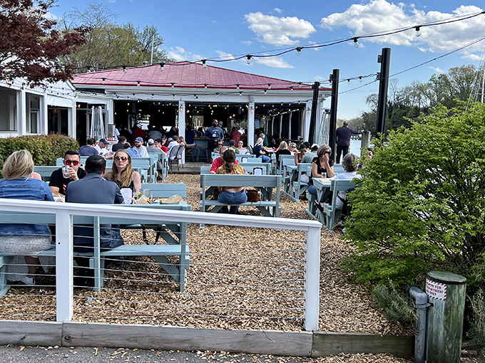 Waterfront paradise found! The Point's outdoor dining area buzzes with happy diners soaking up sunshine and bay breezes while plotting their next crab cake conquest.