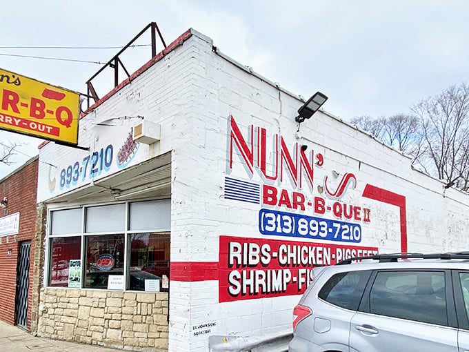 The unassuming white brick exterior of Nunn's Bar-B-Que II stands like a culinary lighthouse on Detroit's west side, promising smoky treasures within.