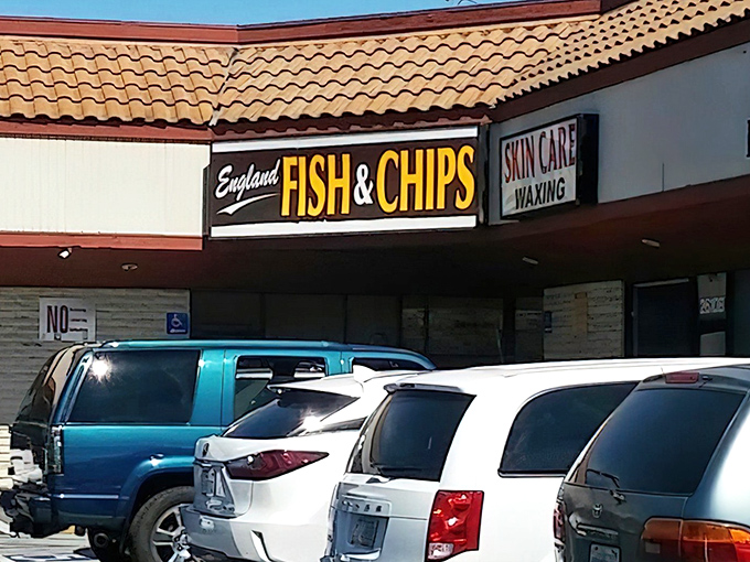 The purple and gold sign beckons like a British bat signal to fried fish aficionados. No cape required, just an appetite for crispy perfection.