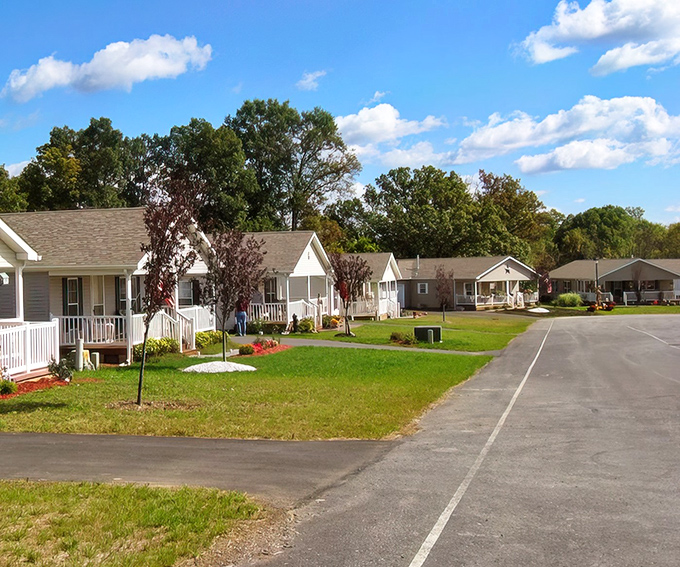Suburban serenity at its finest. These charming homes with their pristine white porches practically whisper, "Come sit a spell and watch the clouds drift by."