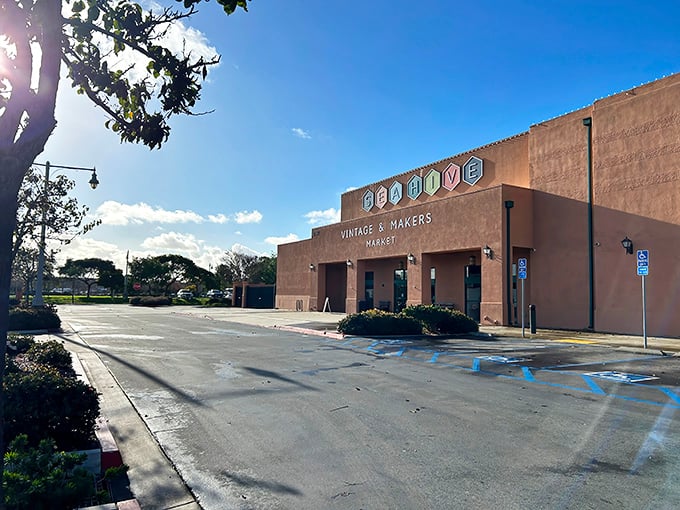 The terracotta fortress of forgotten treasures stands proudly under the California sun, beckoning vintage enthusiasts with its colorful hexagonal welcome sign